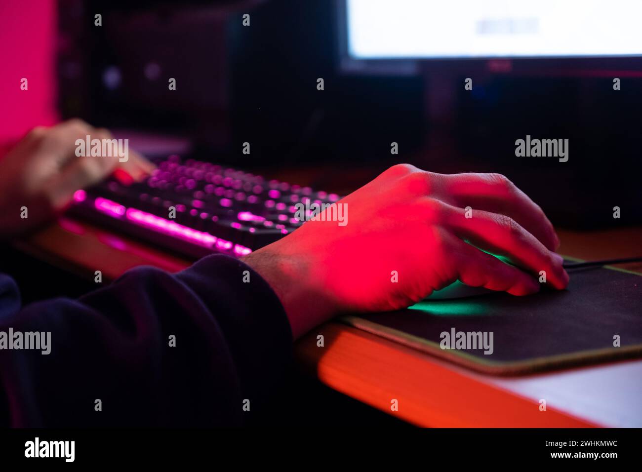 Professional guy typing on his keyboard and playing some game Stock ...