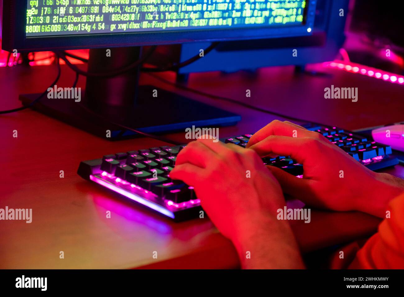 Hands typing on rgb keyboard hi-res stock photography and images - Alamy