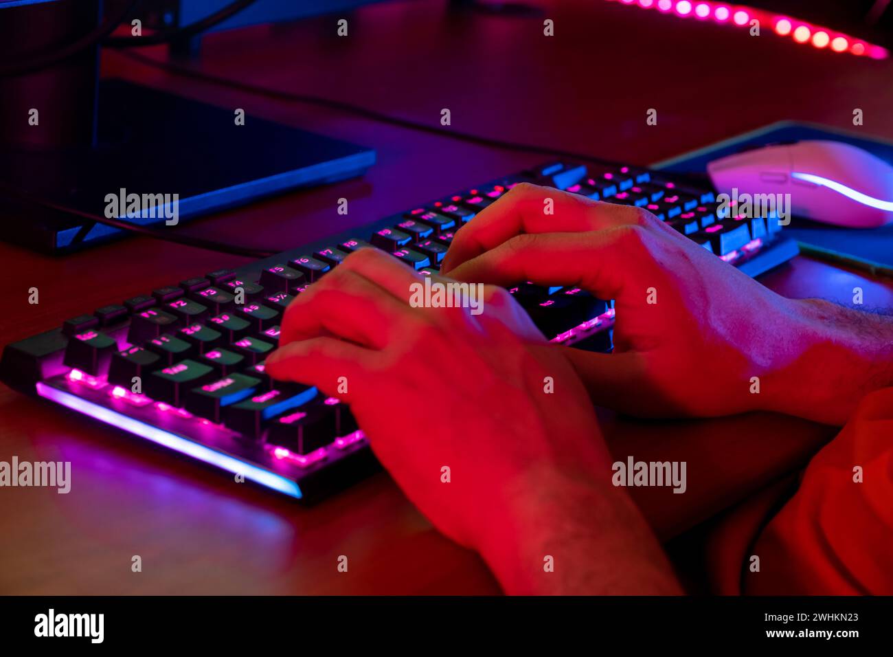 Hands typing on rgb keyboard hi-res stock photography and images - Alamy