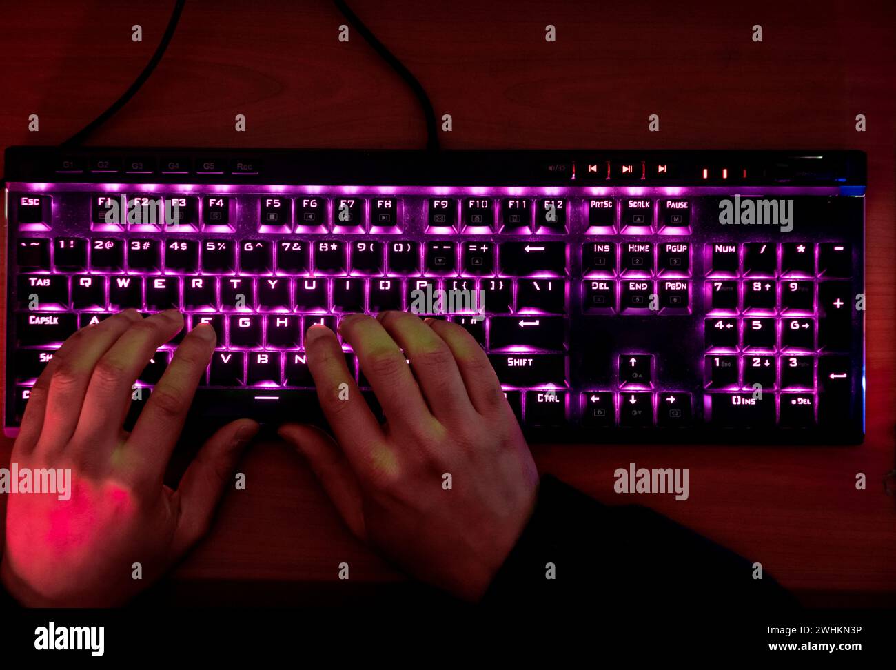 Professional guy typing on his keyboard and playing some game Stock ...