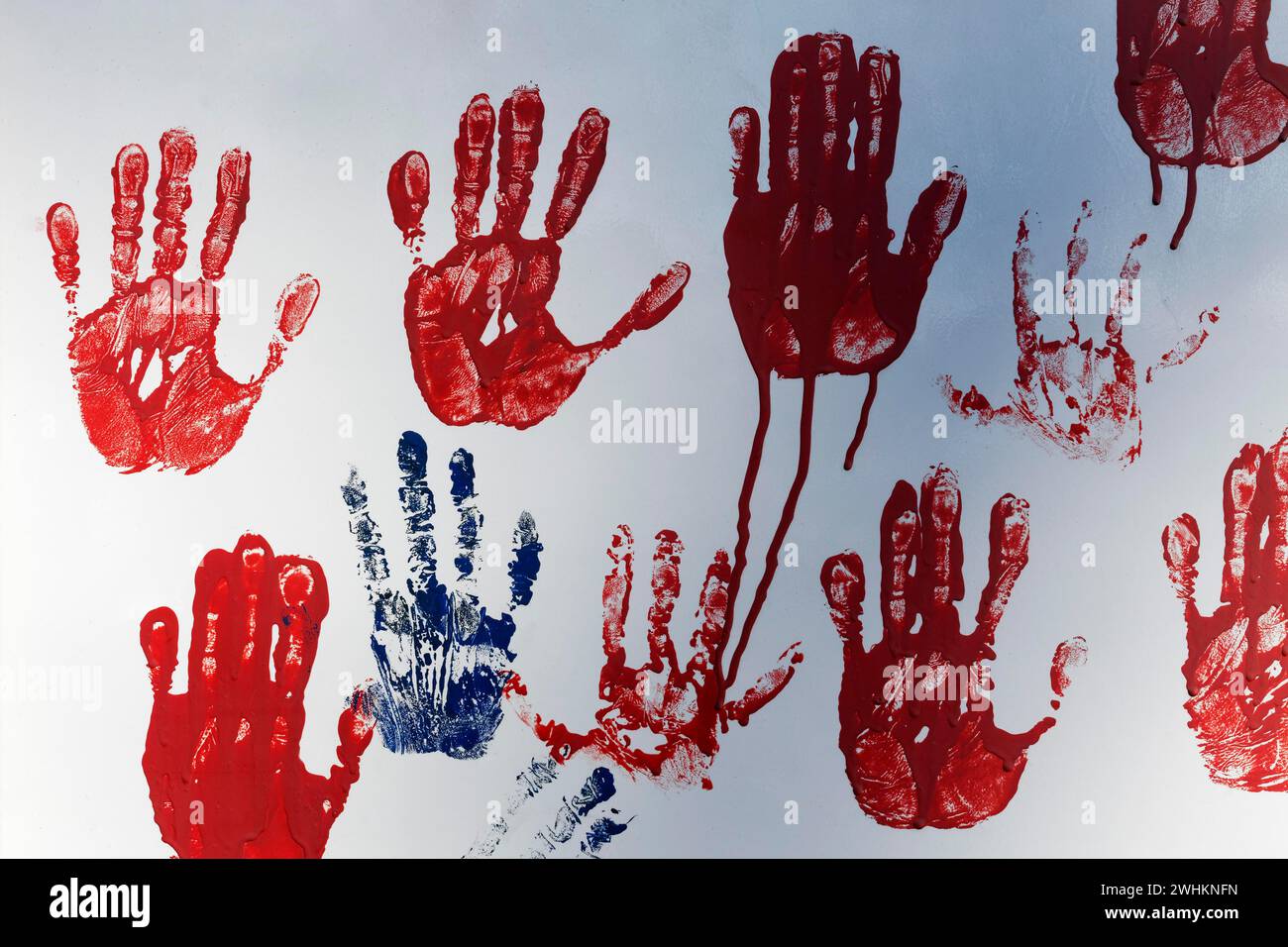 Red handprints on a white wall, Duisburg, North Rhine-Westphalia ...