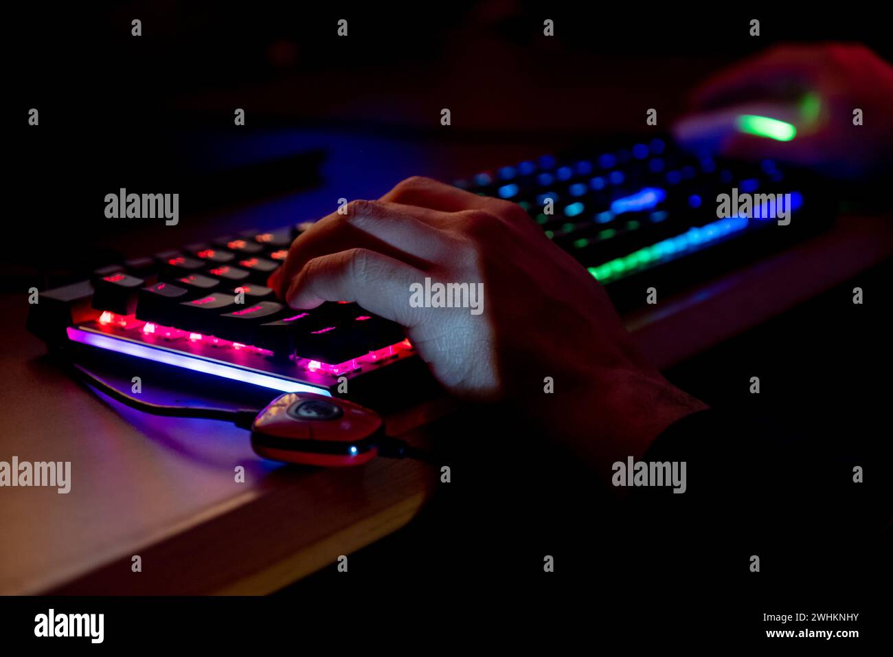 Hands typing keyboard rgb backlight hi-res stock photography and images ...