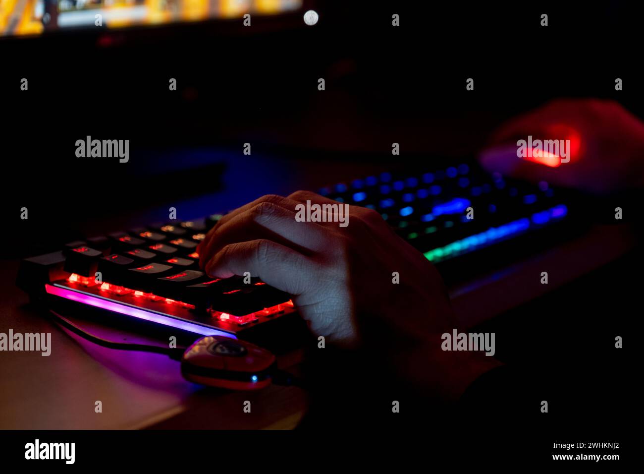 Professional guy typing on his keyboard and playing some game Stock ...