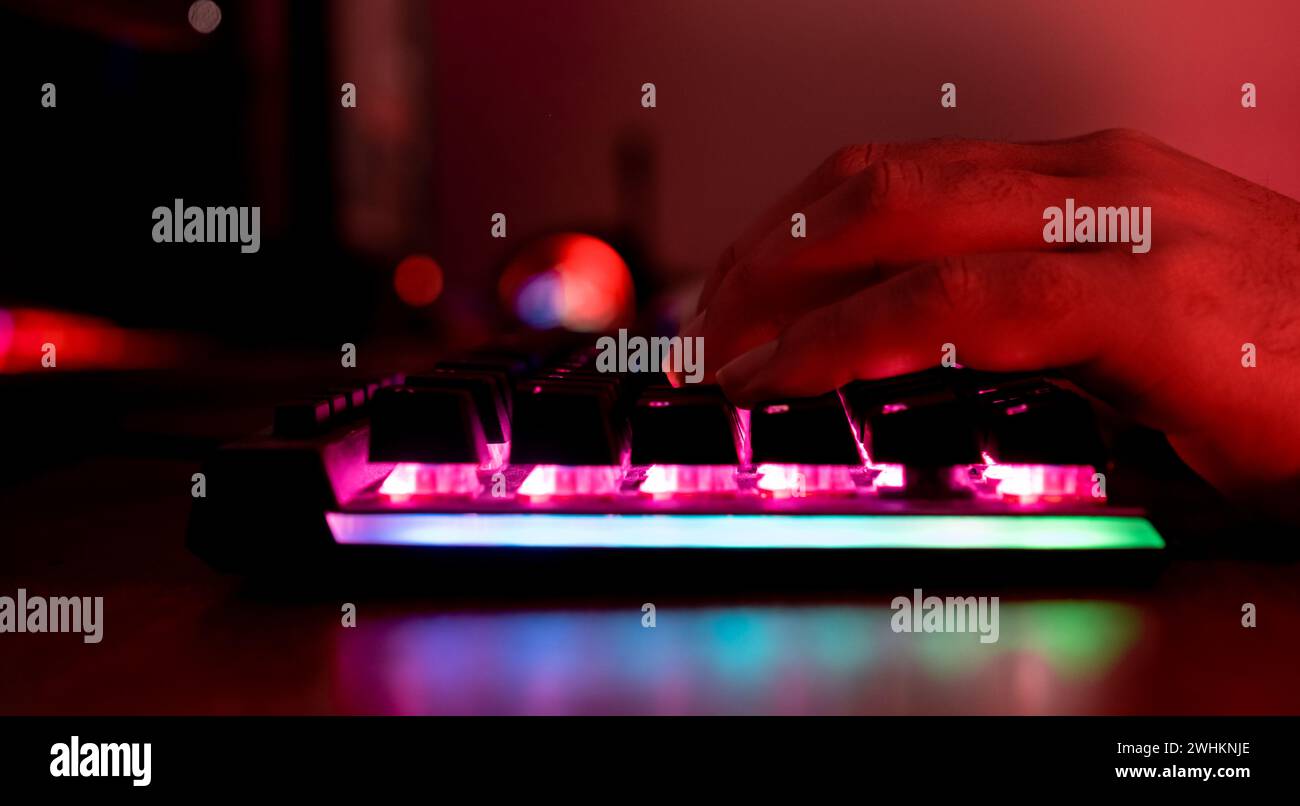 Professional guy typing on his keyboard and playing some game Stock ...