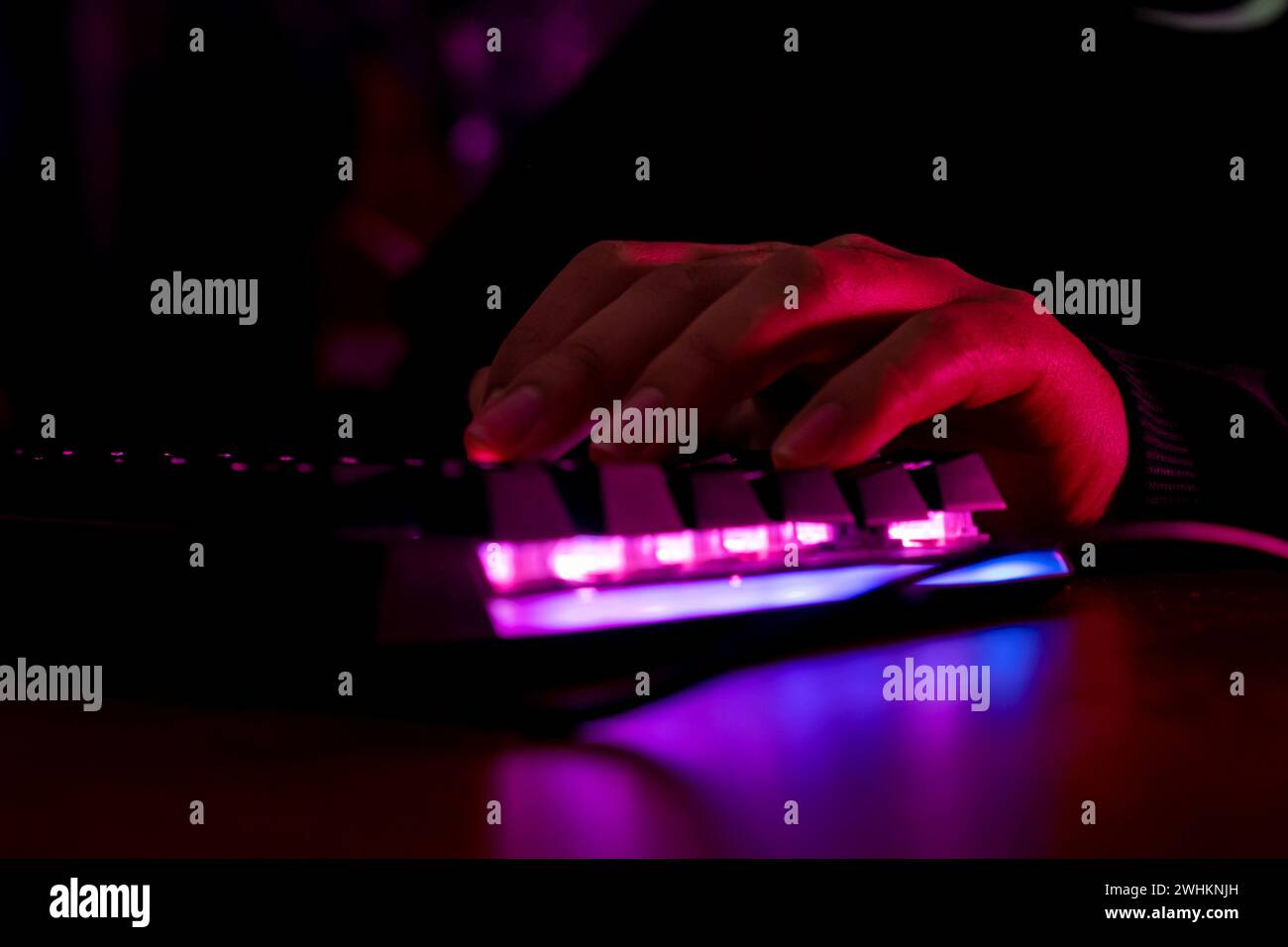 Professional guy typing on his keyboard and playing some game Stock ...