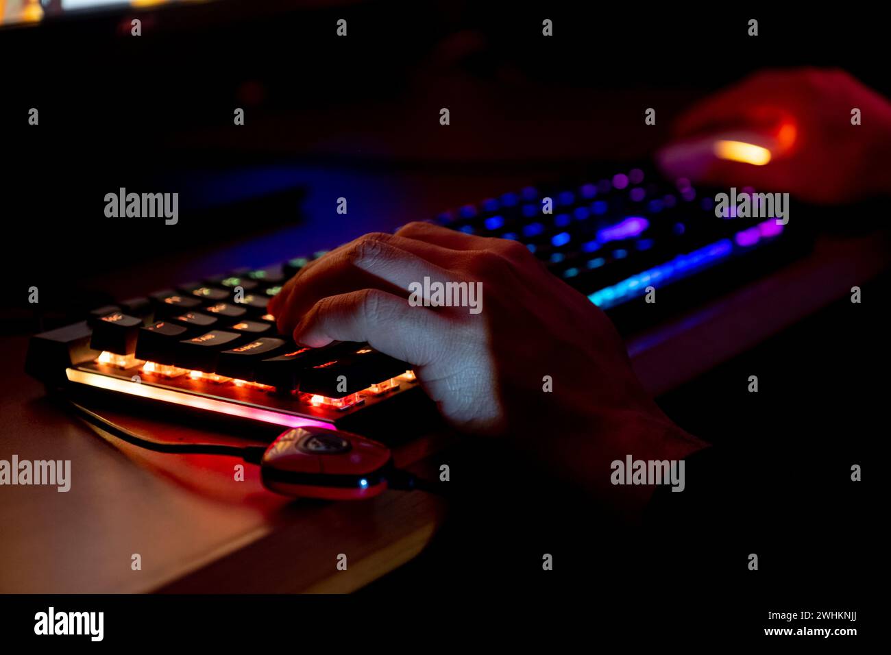 Professional guy typing on his keyboard and playing some game Stock ...