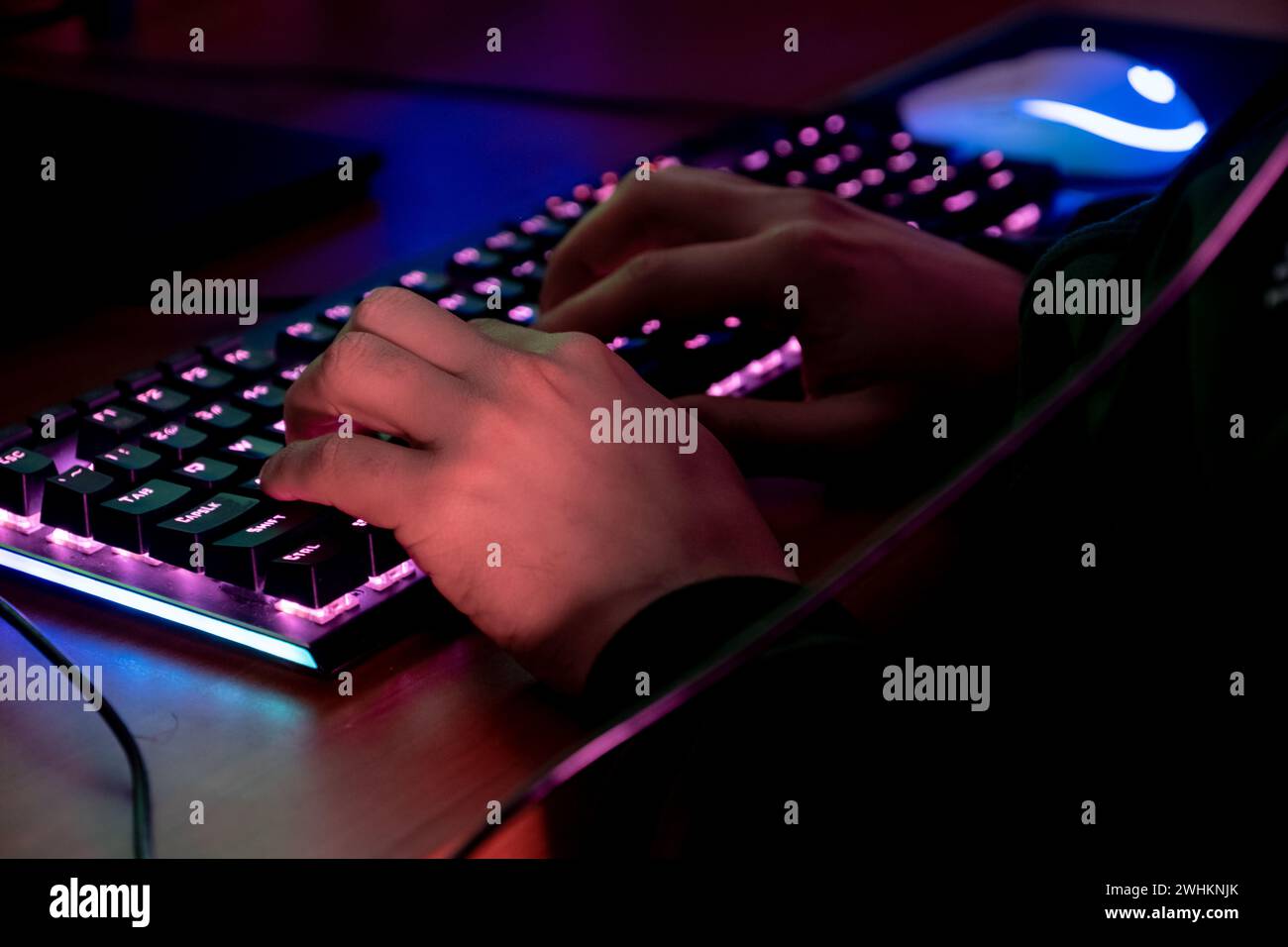 Professional guy typing on his keyboard and playing some game Stock ...