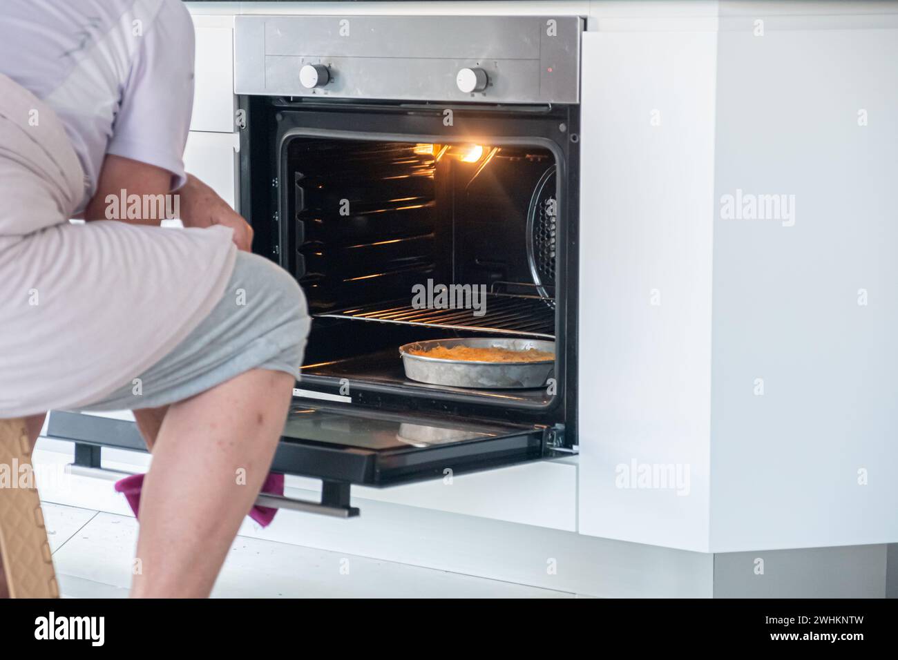 Old woman by electric fire hi-res stock photography and images - Alamy