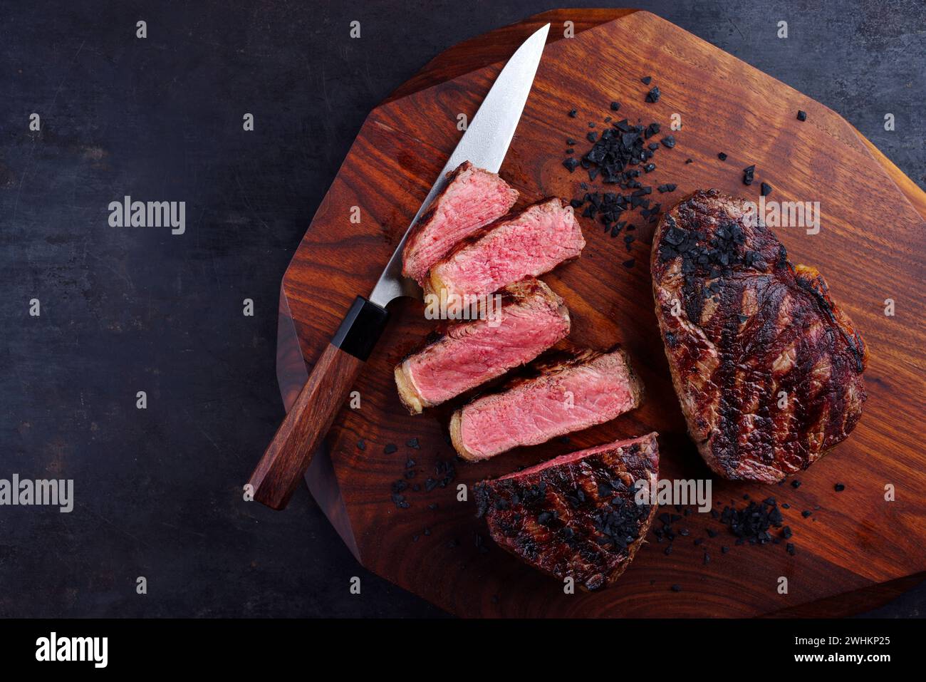 Barbecue dry aged angus roast beef steak sliced and as piece with black ...
