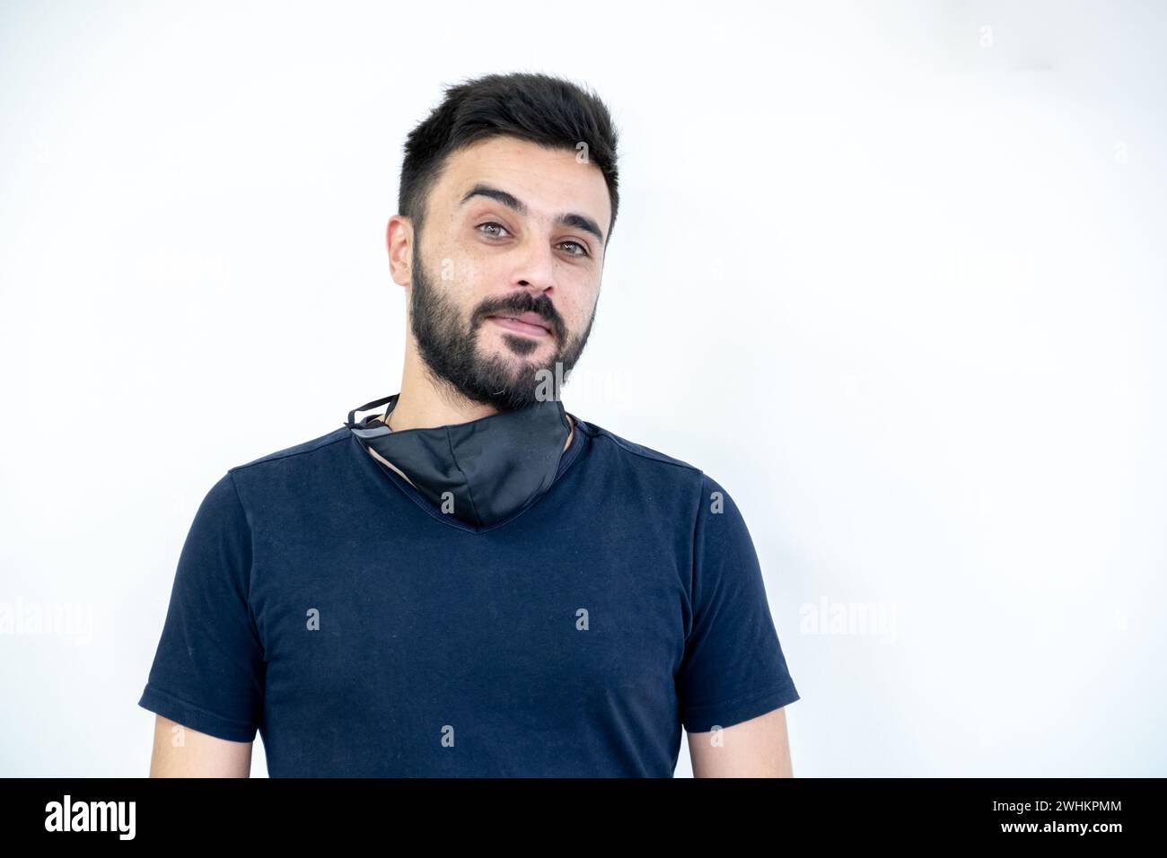 Arabic cheerful man with mask around his neck Stock Photo - Alamy