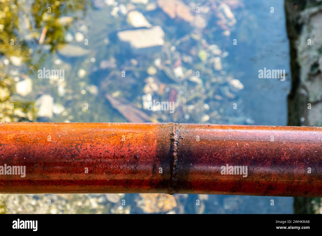 Old rusty metallic pipe line for water transmission Stock Photo - Alamy