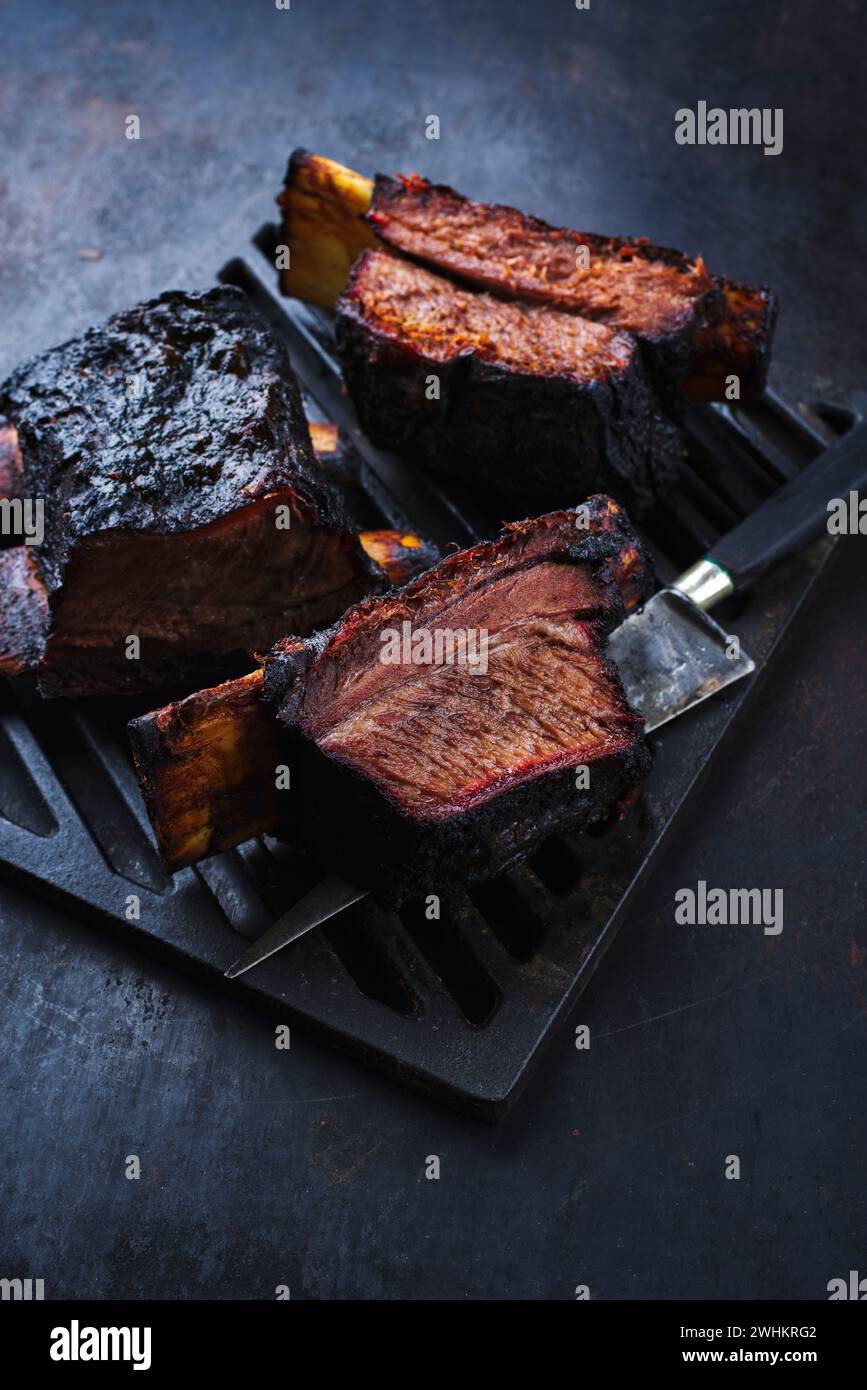 Traditional barbecue burnt chuck beef ribs marinated with spicy rub and ...