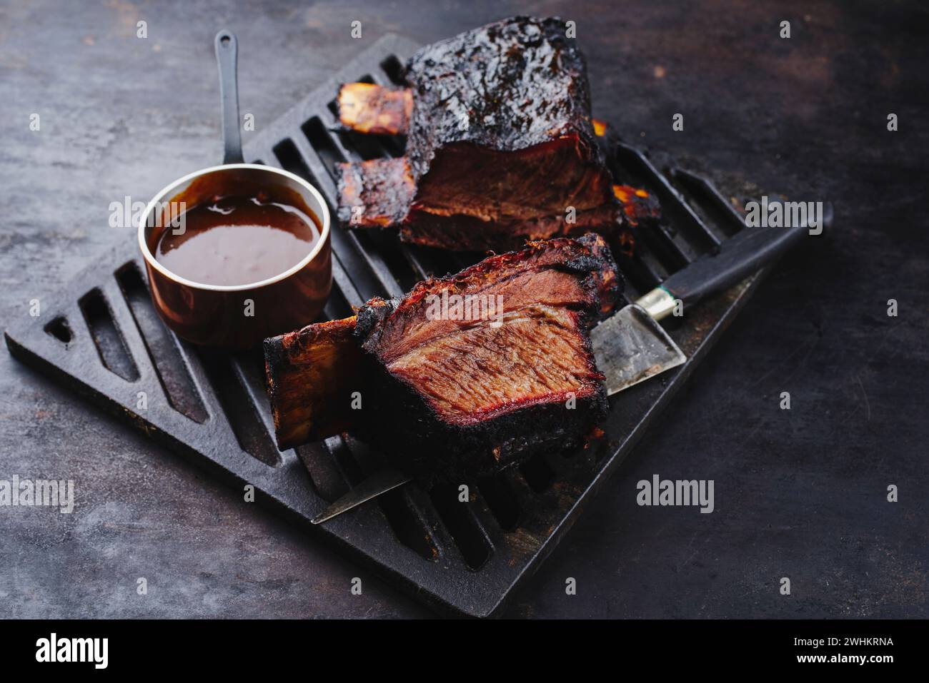 Traditional barbecue burnt chuck beef ribs marinated with spicy rub and ...