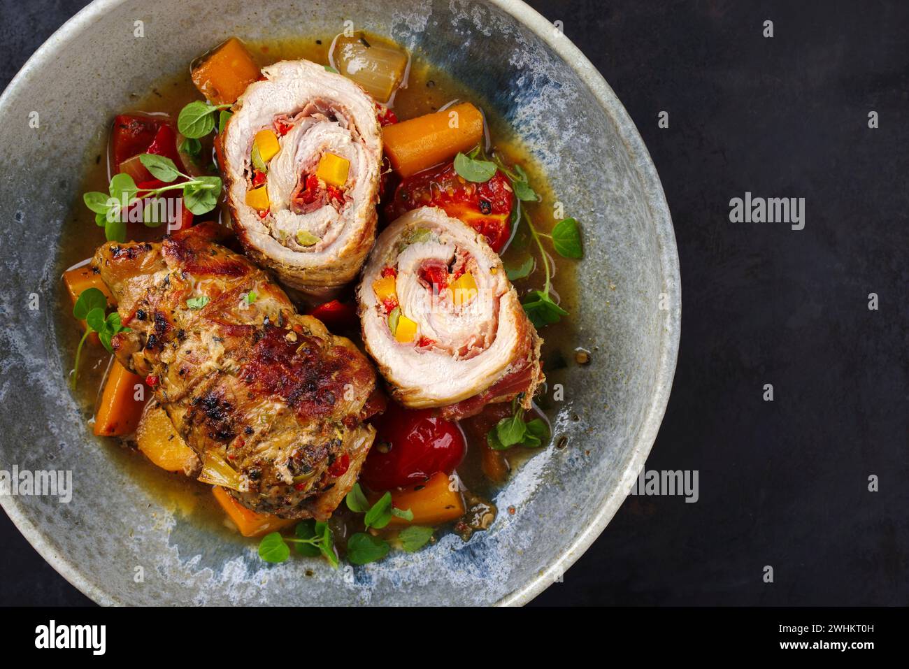 Traditional slow cooked German pork roulades with vegetable and bacon ...