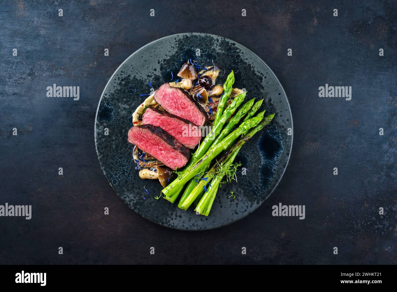 Gourmet barbecue dry aged angus beef steak with green asparagus and ...