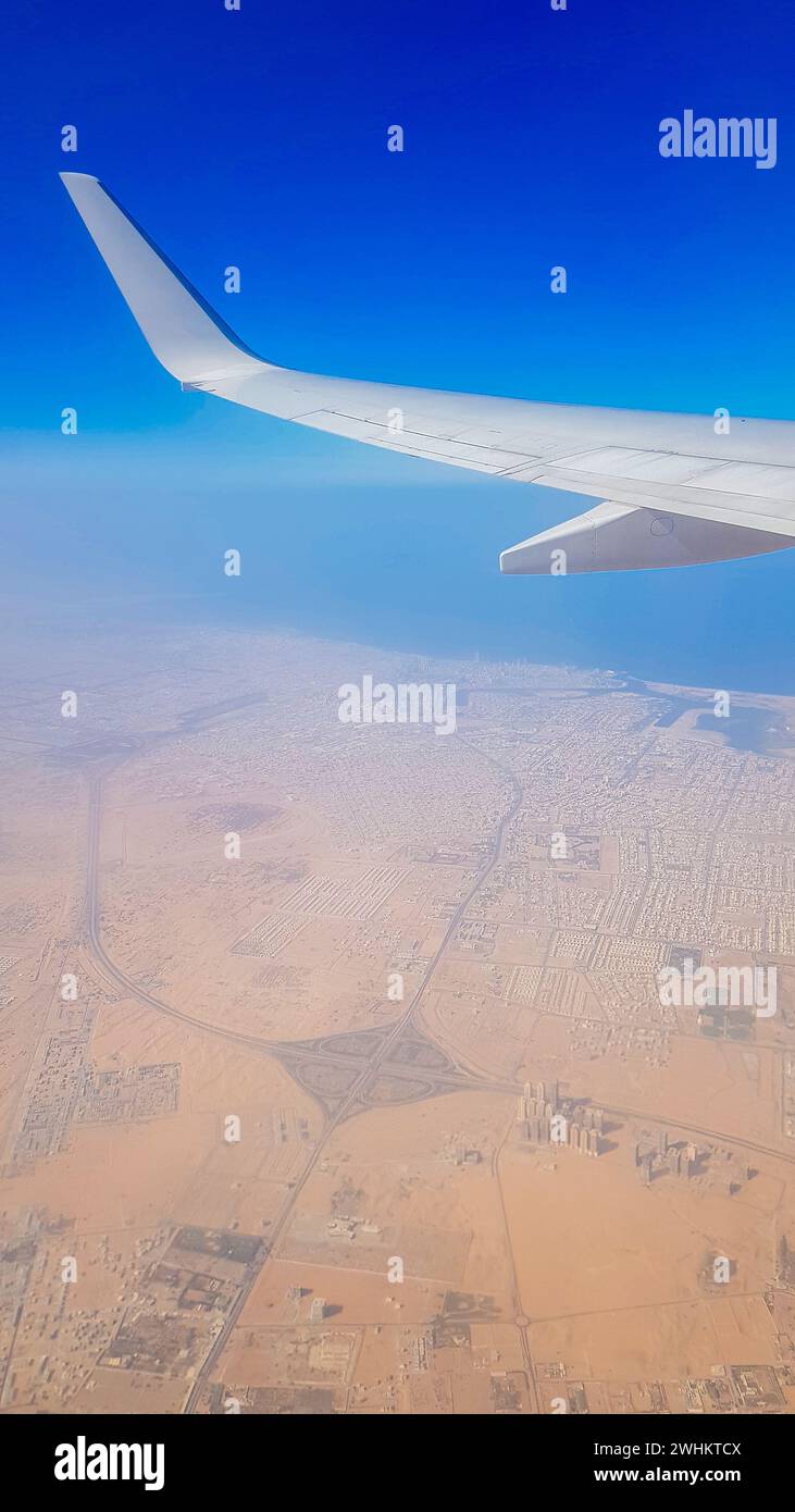 View from the window of plane on blue sky and earth with landscape of ...