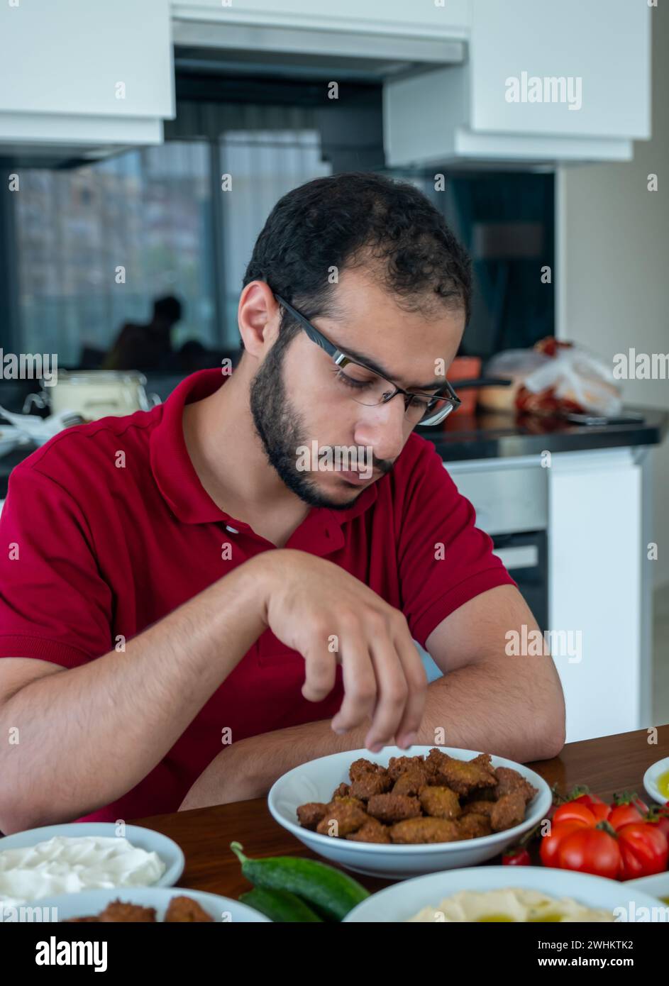 Arabic man is eating breakfast Stock Photo - Alamy