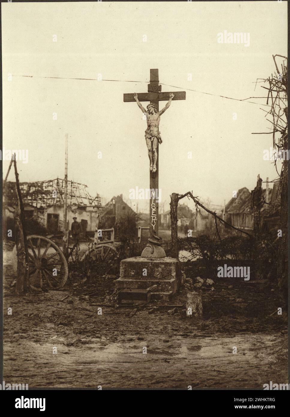 A crucifix left standing in a town devastated by the war. Images from ...