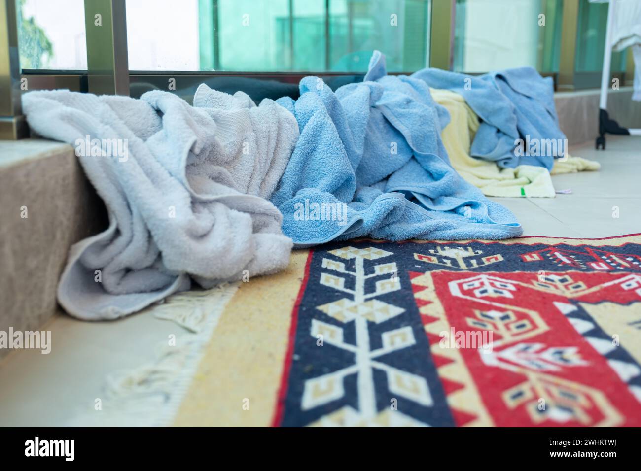 Side view for towels on the floor Stock Photo - Alamy