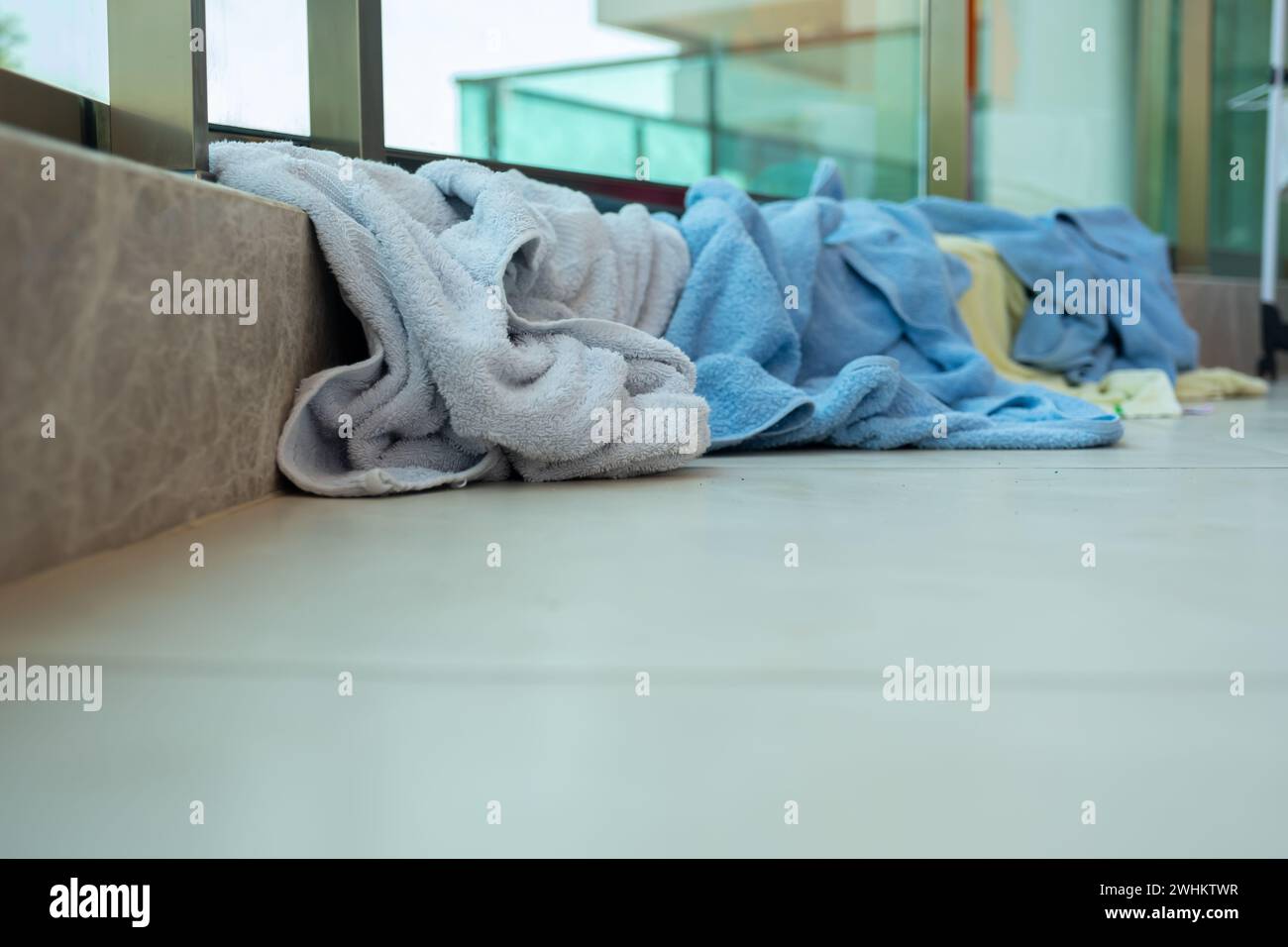 Side view for towels on the floor Stock Photo - Alamy