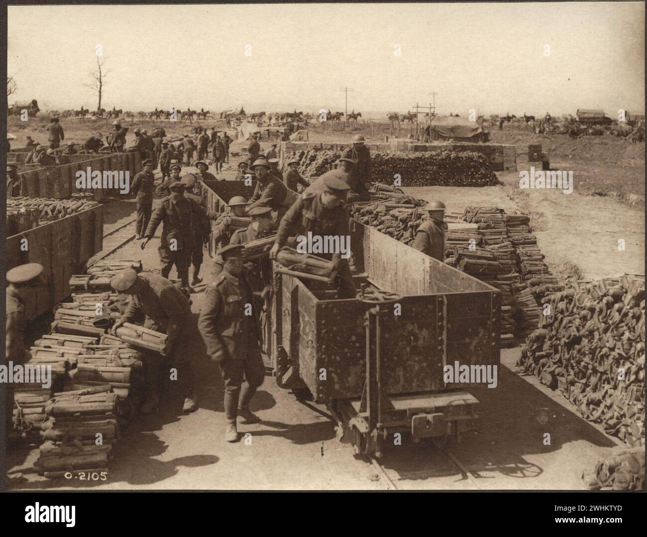 An ammunition loading station. Soldiers loading shells onty rail ...