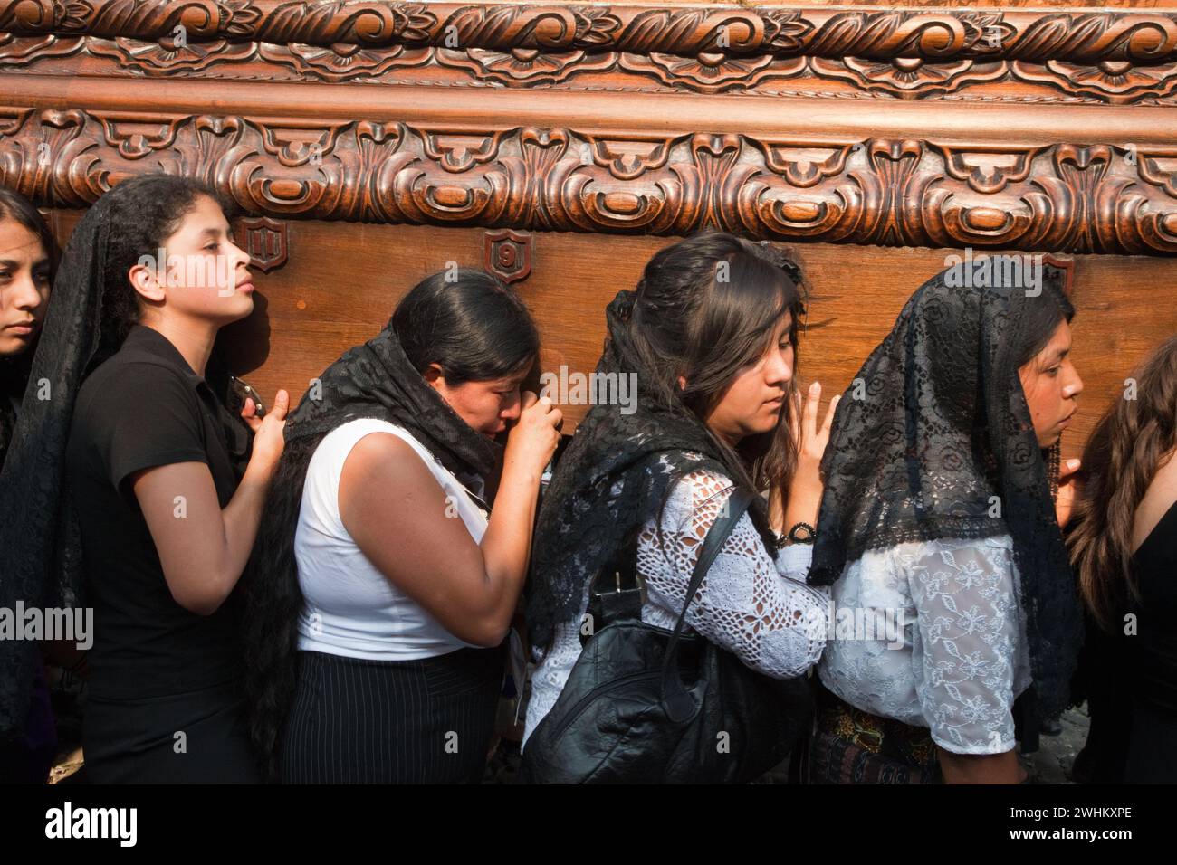 Antigua, Guatemala. Semana Santa (Holy Week). Women carrying an anda ...