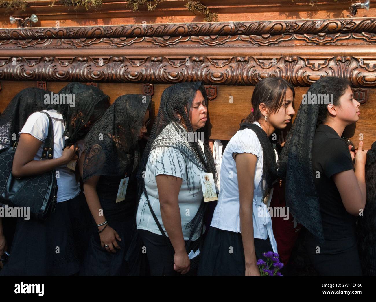 Antigua, Guatemala. Semana Santa (Holy Week). Women carrying an anda ...
