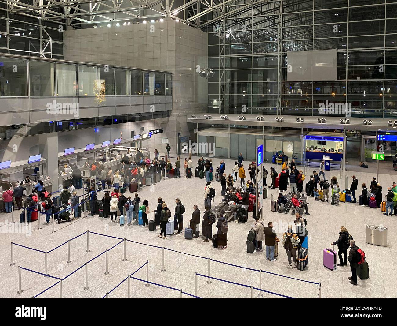 Check-in, check-in, passengers checking in baggage, waiting hall ...