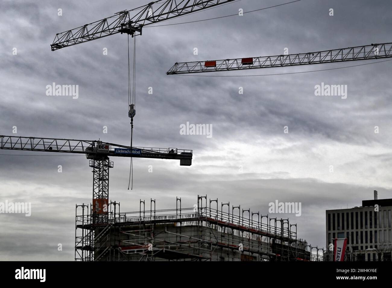 Symbolic image construction site construction cranes Stock Photo - Alamy