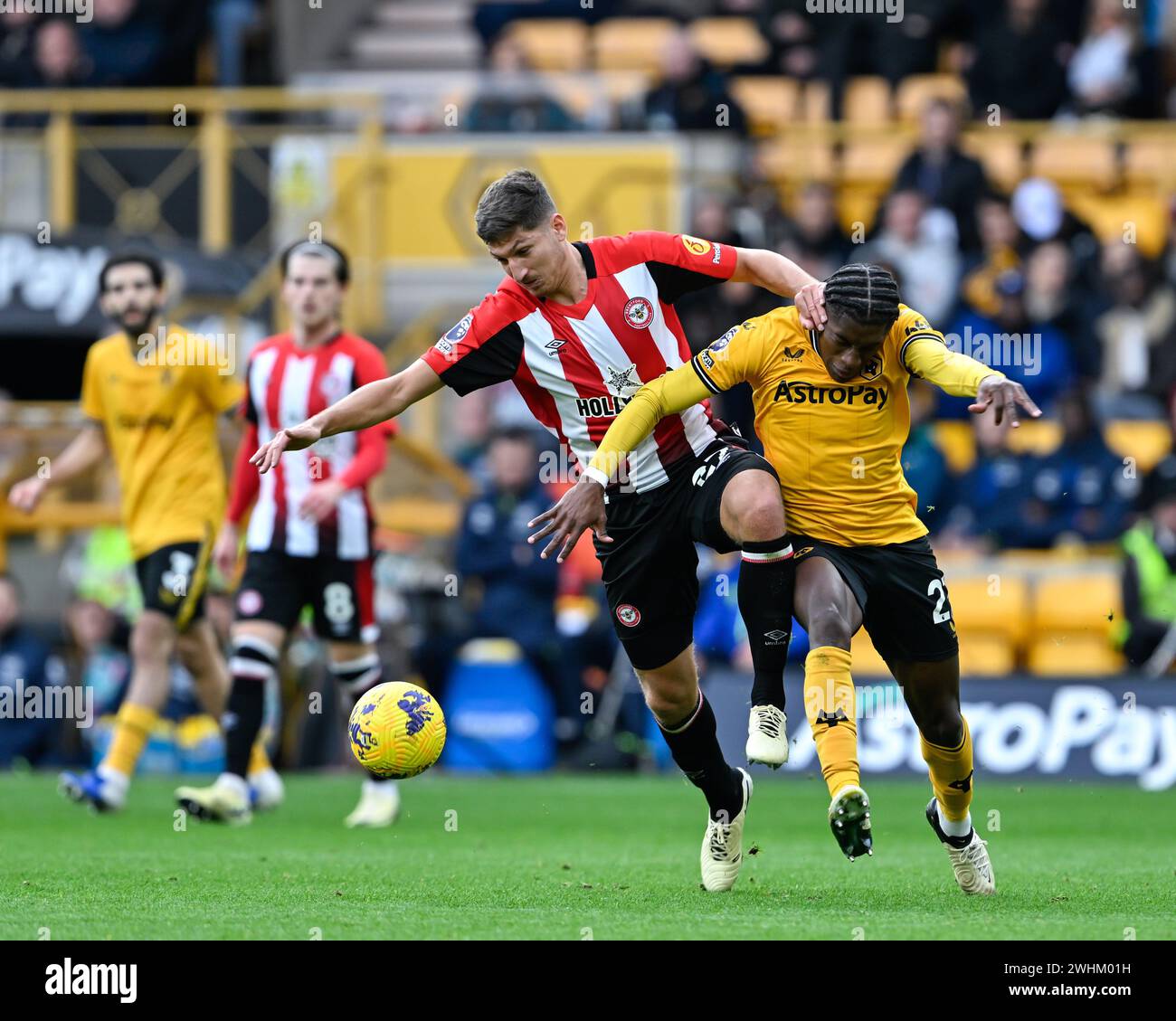 Vitaly Janelt of Brentford and Jean-Ricner Bellegarde of Wolverhampton ...