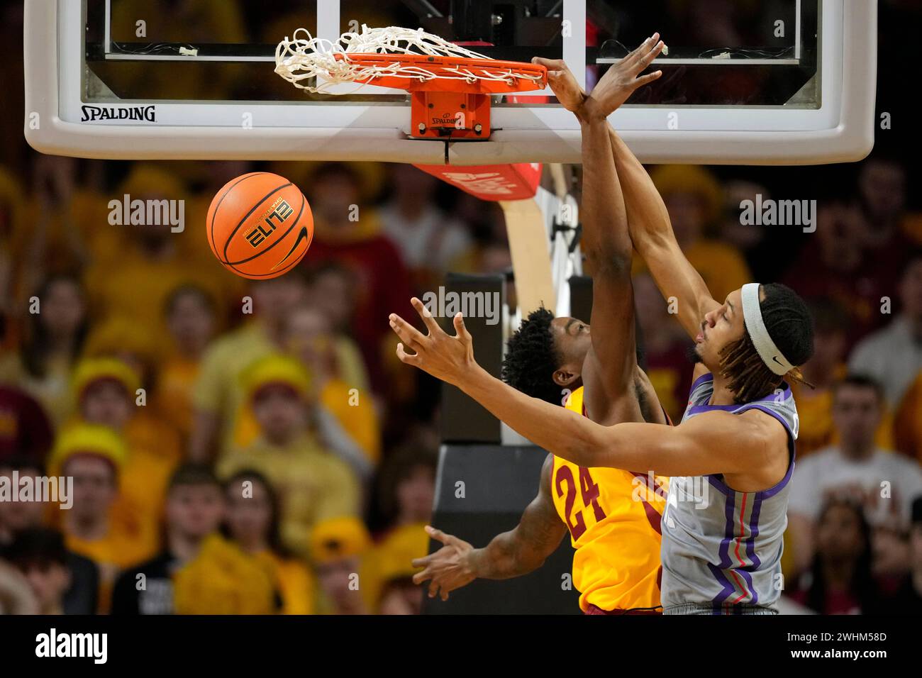 TCU forward Xavier Cork, right, dunks the ball over Iowa State forward ...