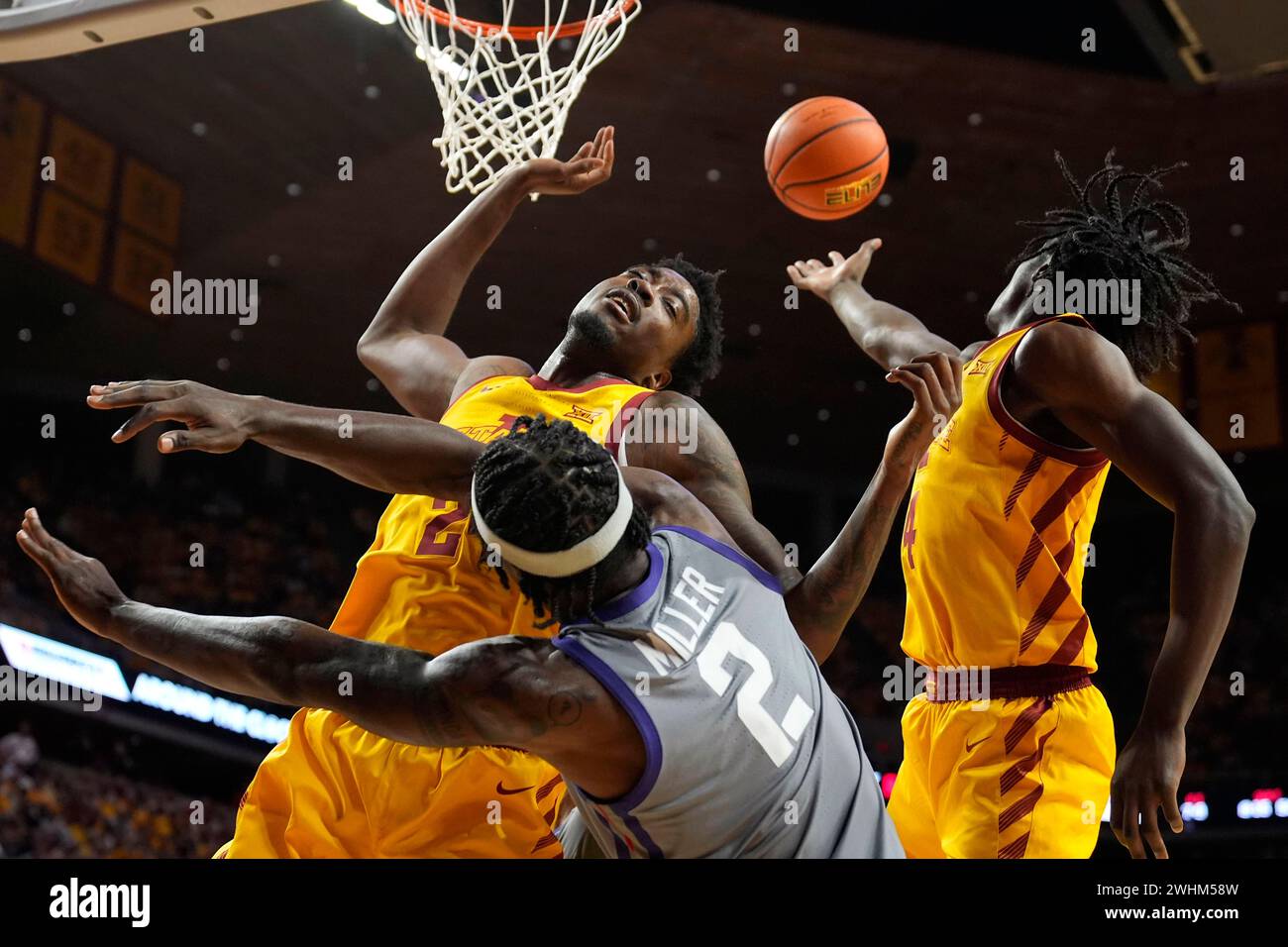 TCU forward Emanuel Miller (2) fights for a rebound with Iowa State ...