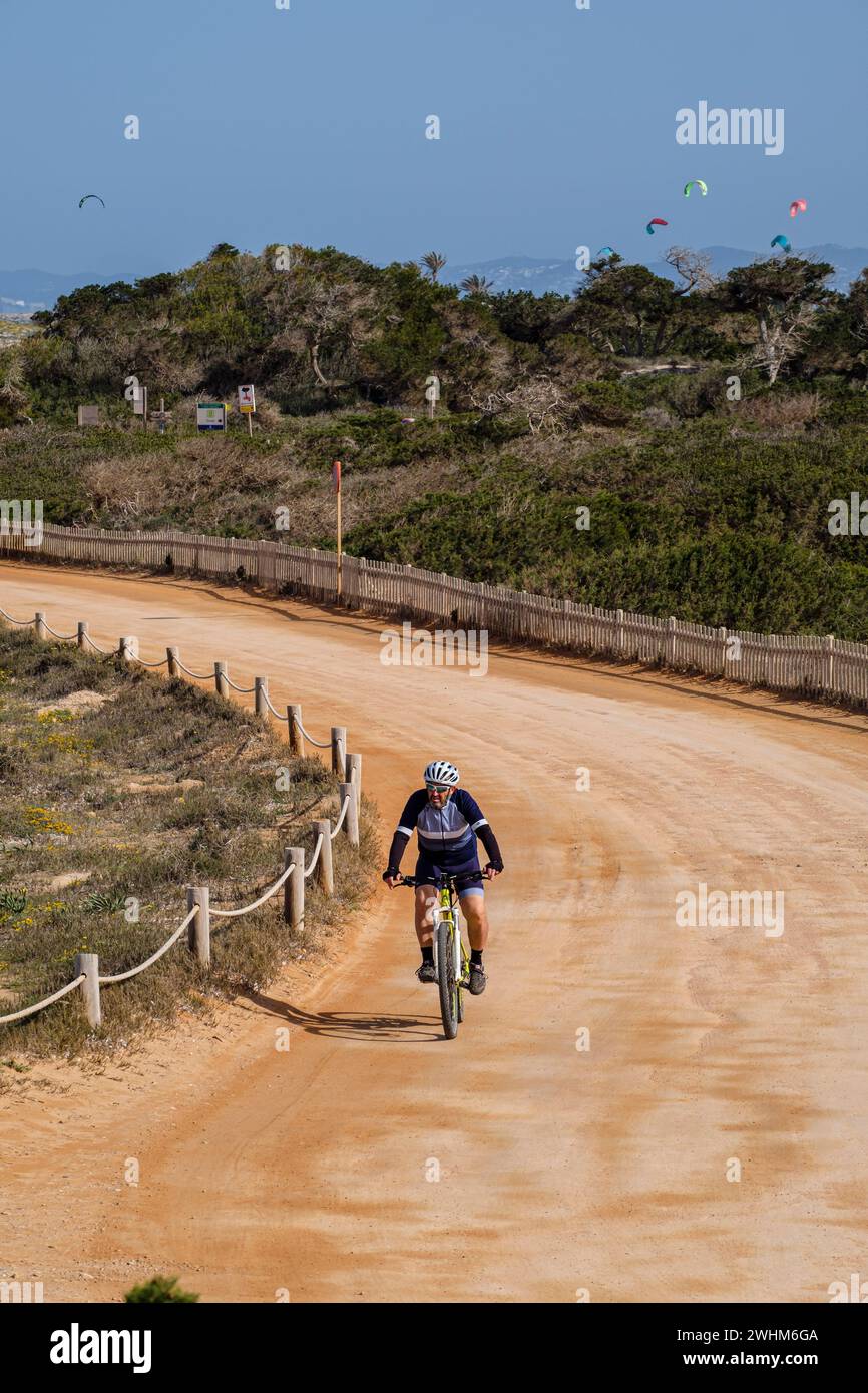 Tourist cycle on Illetes Path Stock Photo - Alamy