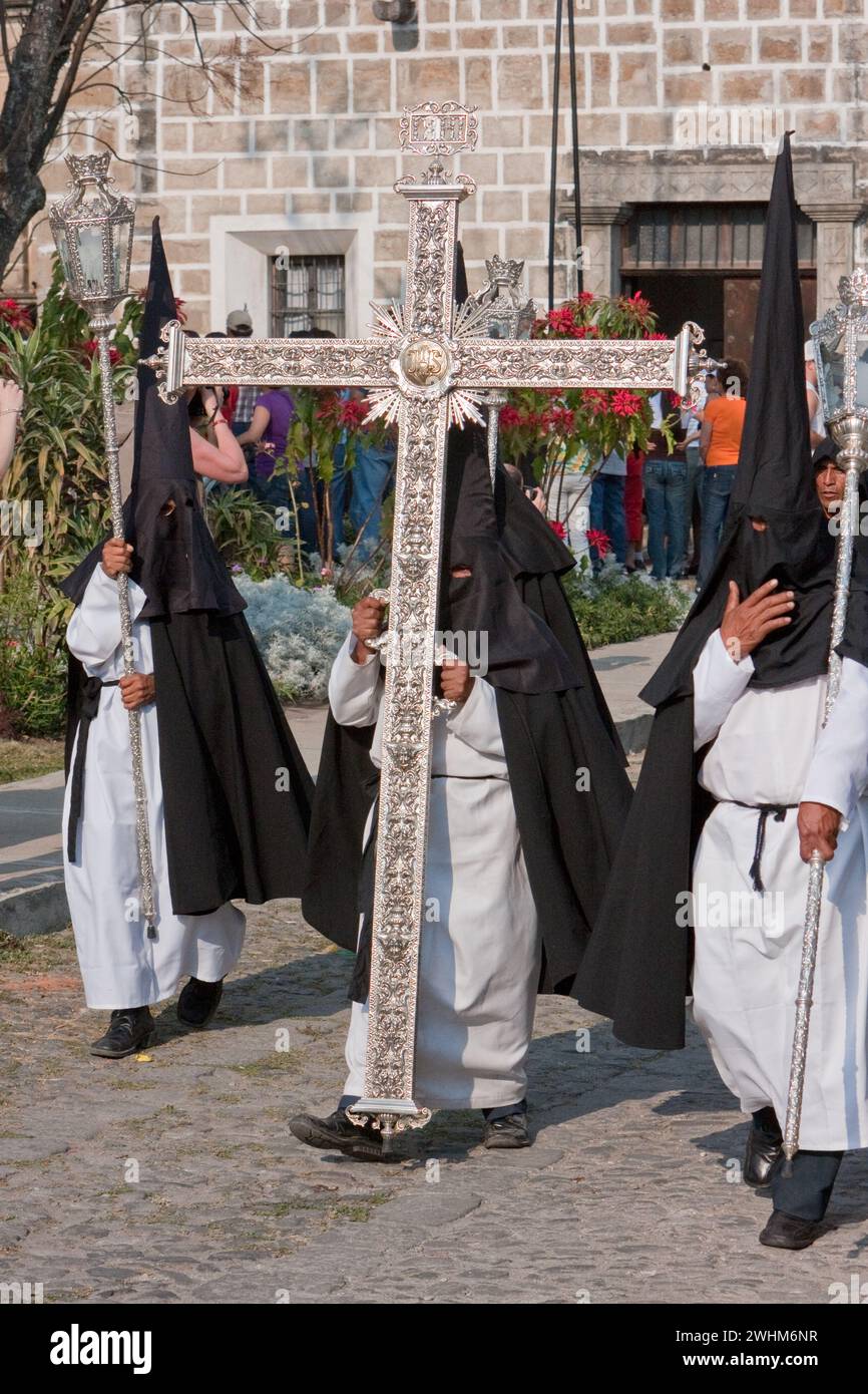 Antigua, Guatemala. Holy Saturday. Nazarenos Carrying a Silver Cross in ...