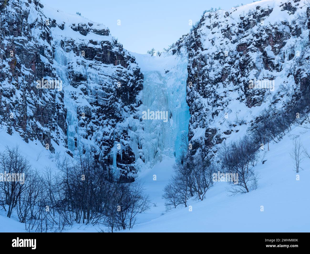 Njupeskär water fall frozen into ice in winter time. It is the tallest ...