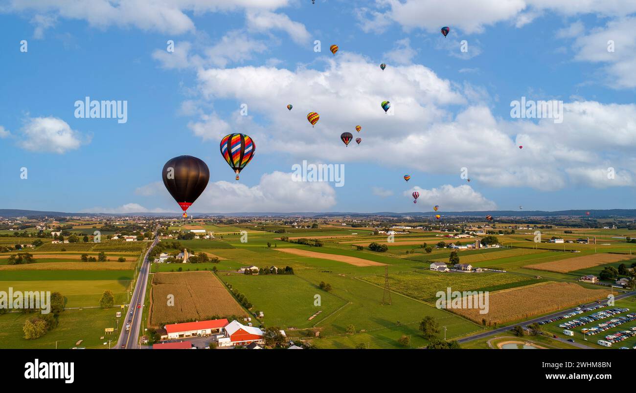 An Aerial View Of Many Hot Air Balloons Launching and Floating Away ...