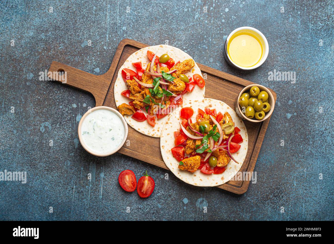Cooking Traditional Greek Dish Gyros: Pita bread with vegetables, meat ...