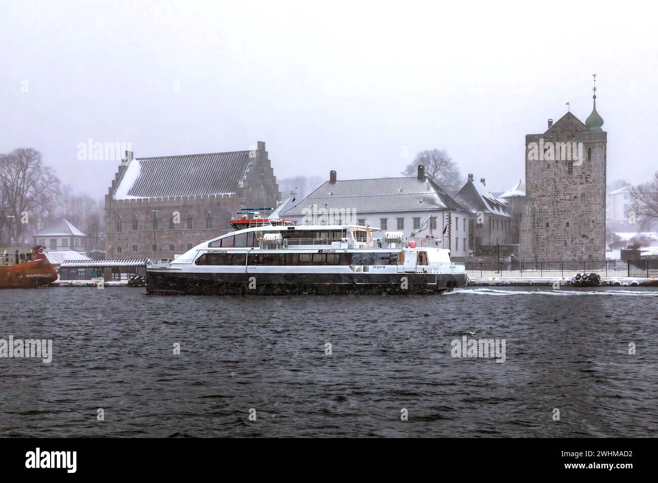 High speed catamaran Ekspressen departing from the port of Bergen ...