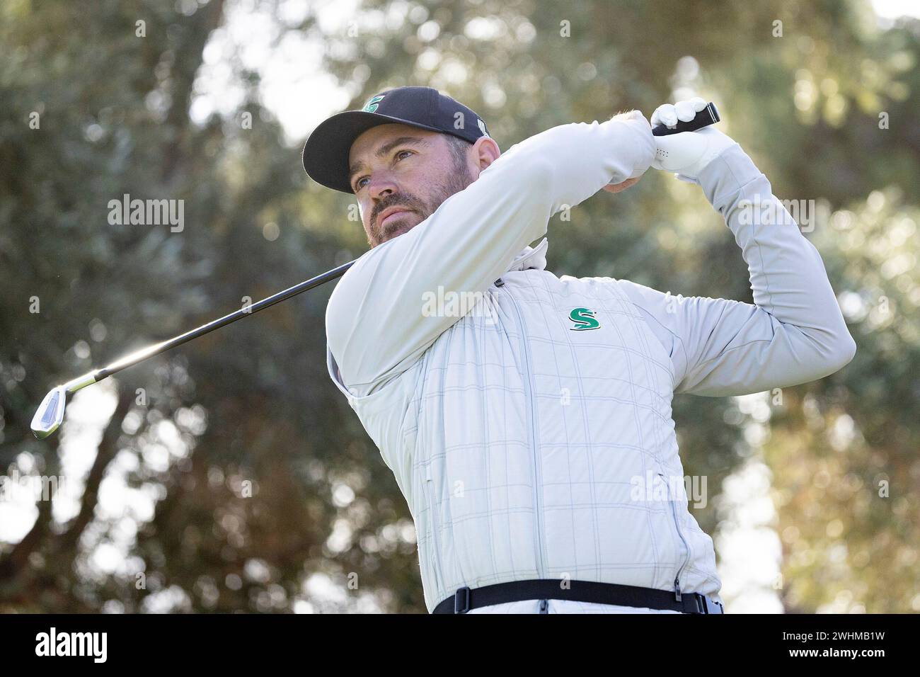 Captain Louis Oosthuizen of Stinger GC hits his shot from the 12th tee ...