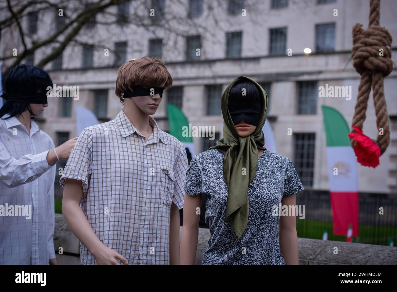 London, UK. 10th Feb, 2024. Masked sculptures are juxtaposed with a ...