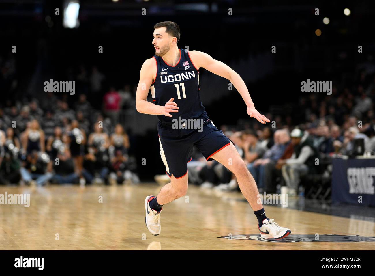 Connecticut forward Alex Karaban (11) in action during the first half ...