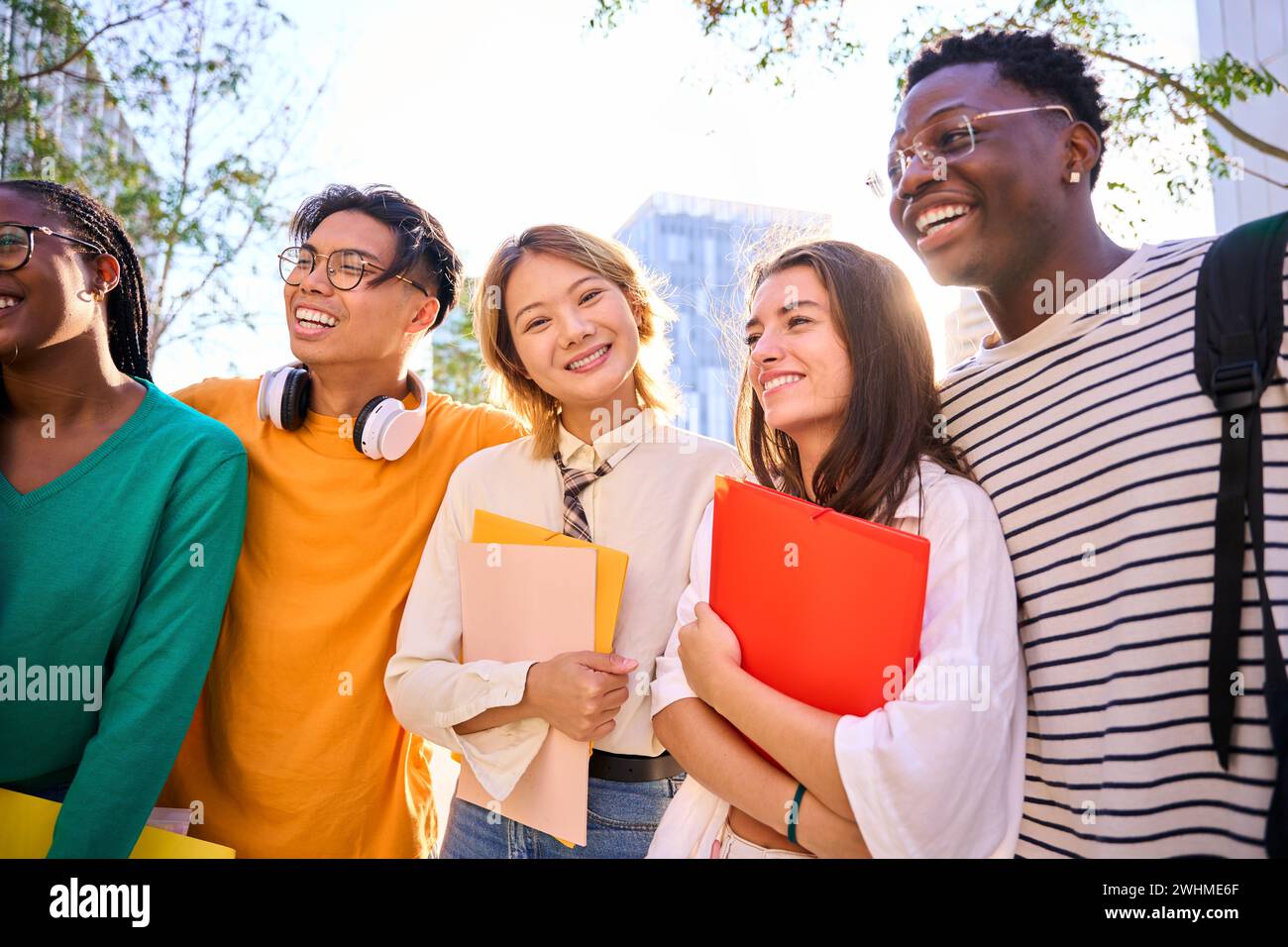 Happy young multiracial university students posing together taking a photo Stock Photo - Alamy