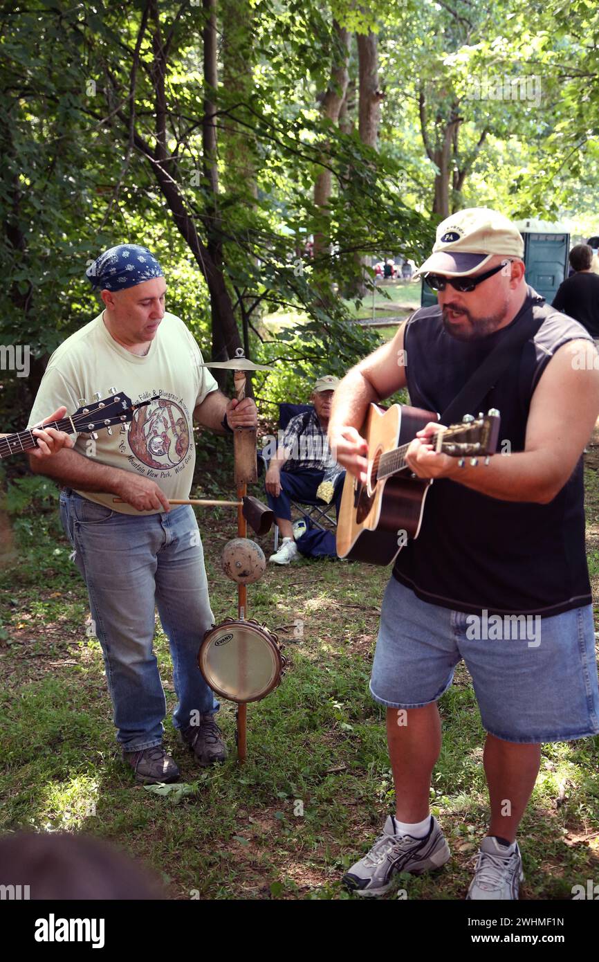 Guitar and unique percussion instrument make music at Old Fiddlers ...