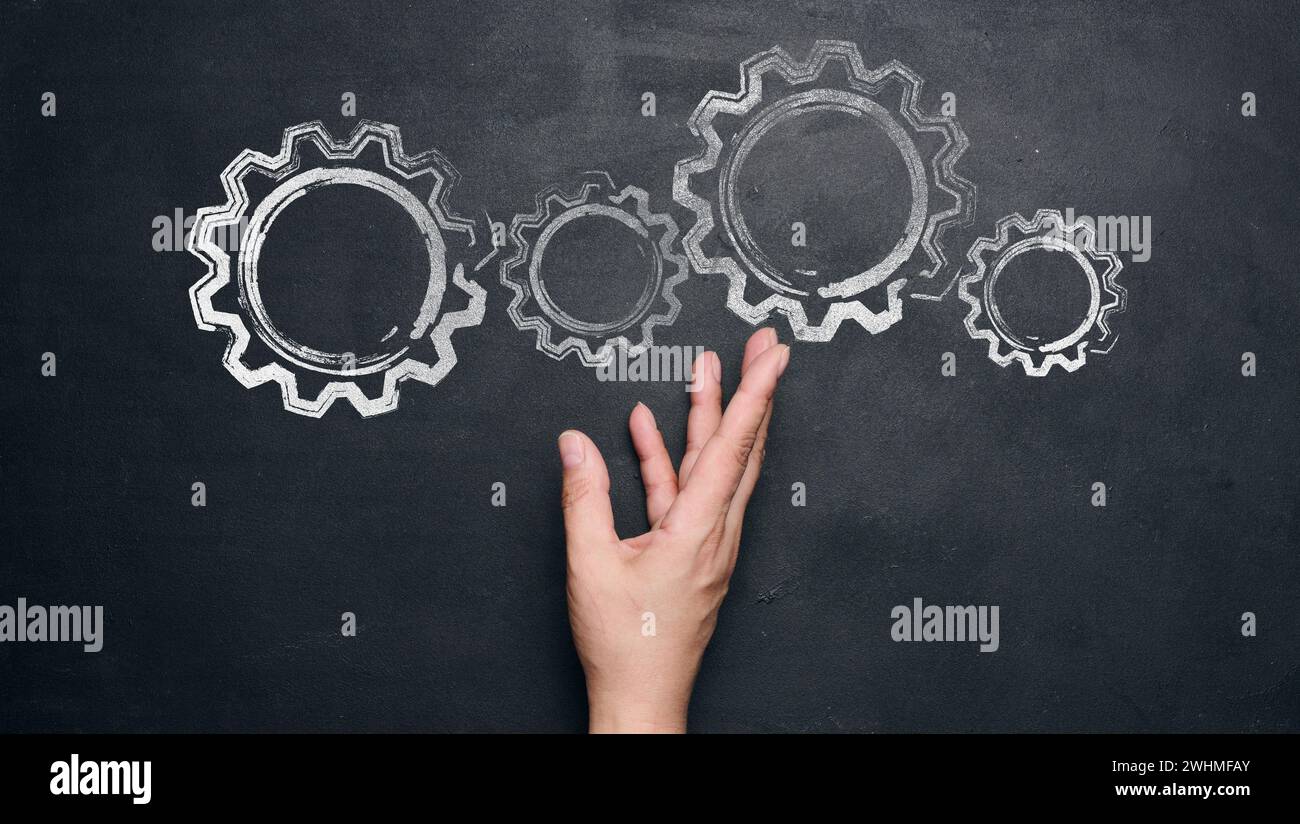 Teamwork gears hi-res stock photography and images - Alamy