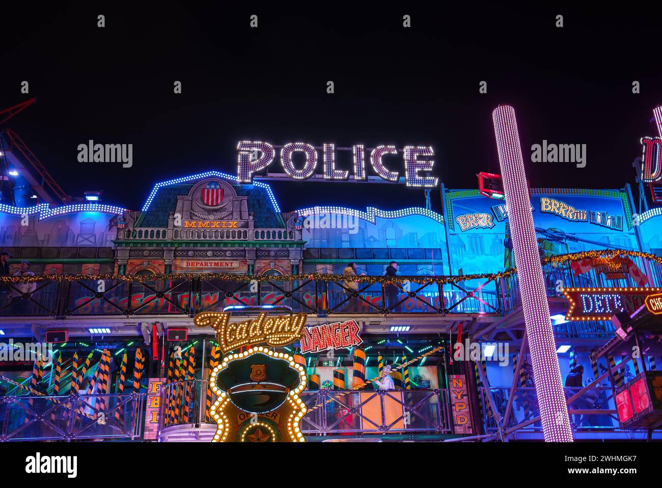 Vibrant Police Academy Themed Fairground Attraction, London Night Stock ...