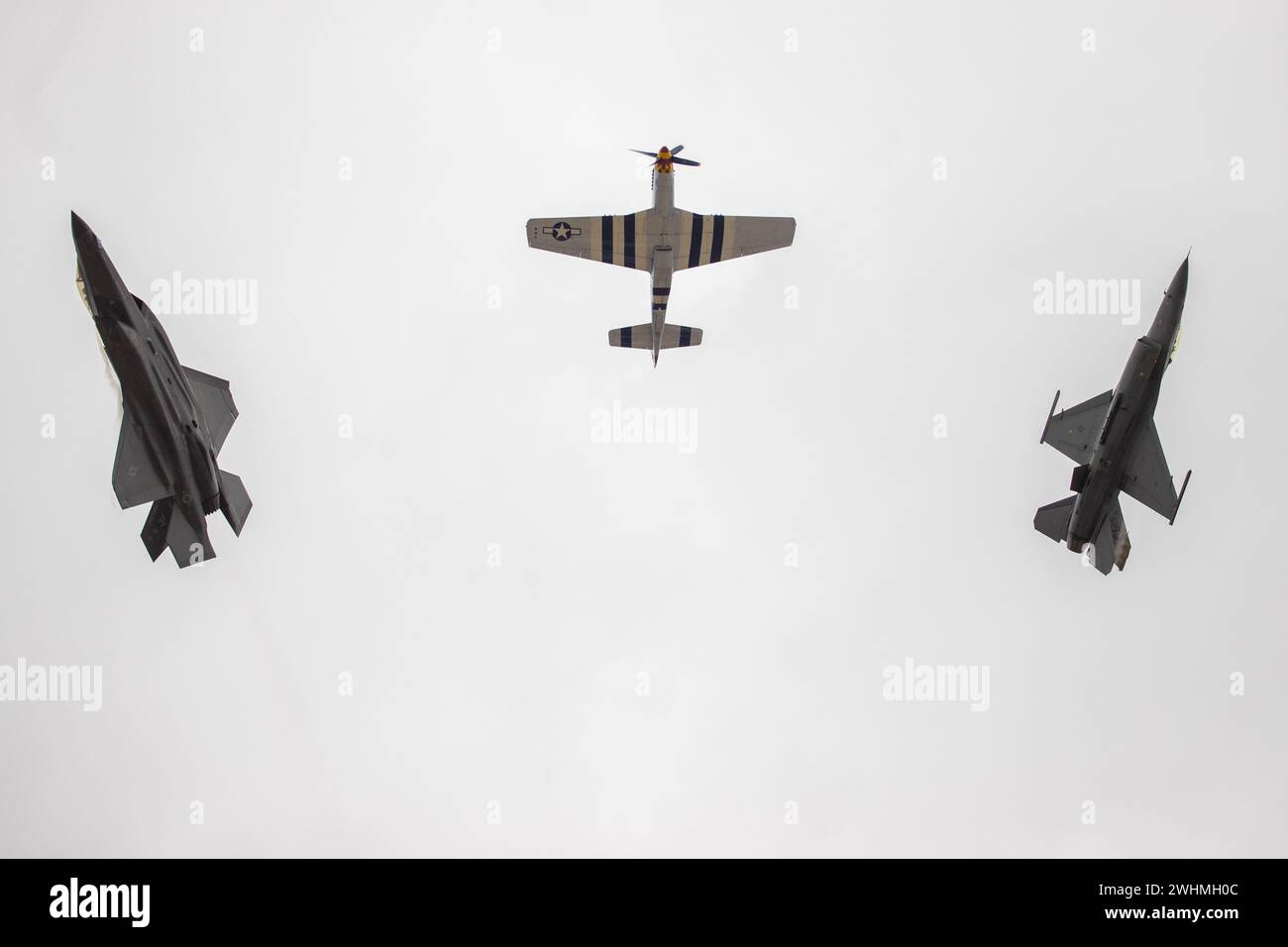 An F-35A Lightning II (left) and an F-16 Fighting Falcon (right) break ...