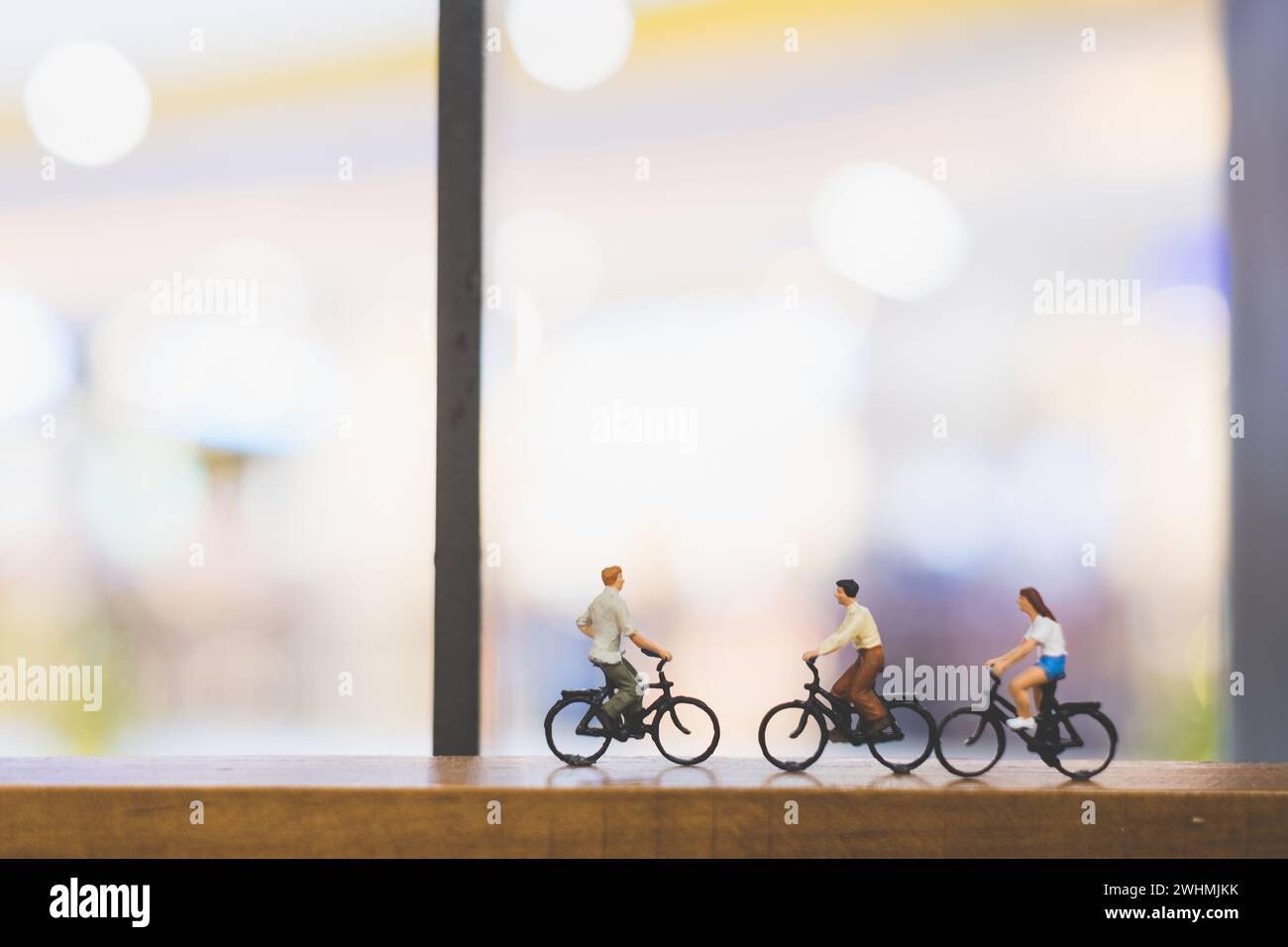 Travellers with bicycle on wood bridge Stock Photo - Alamy