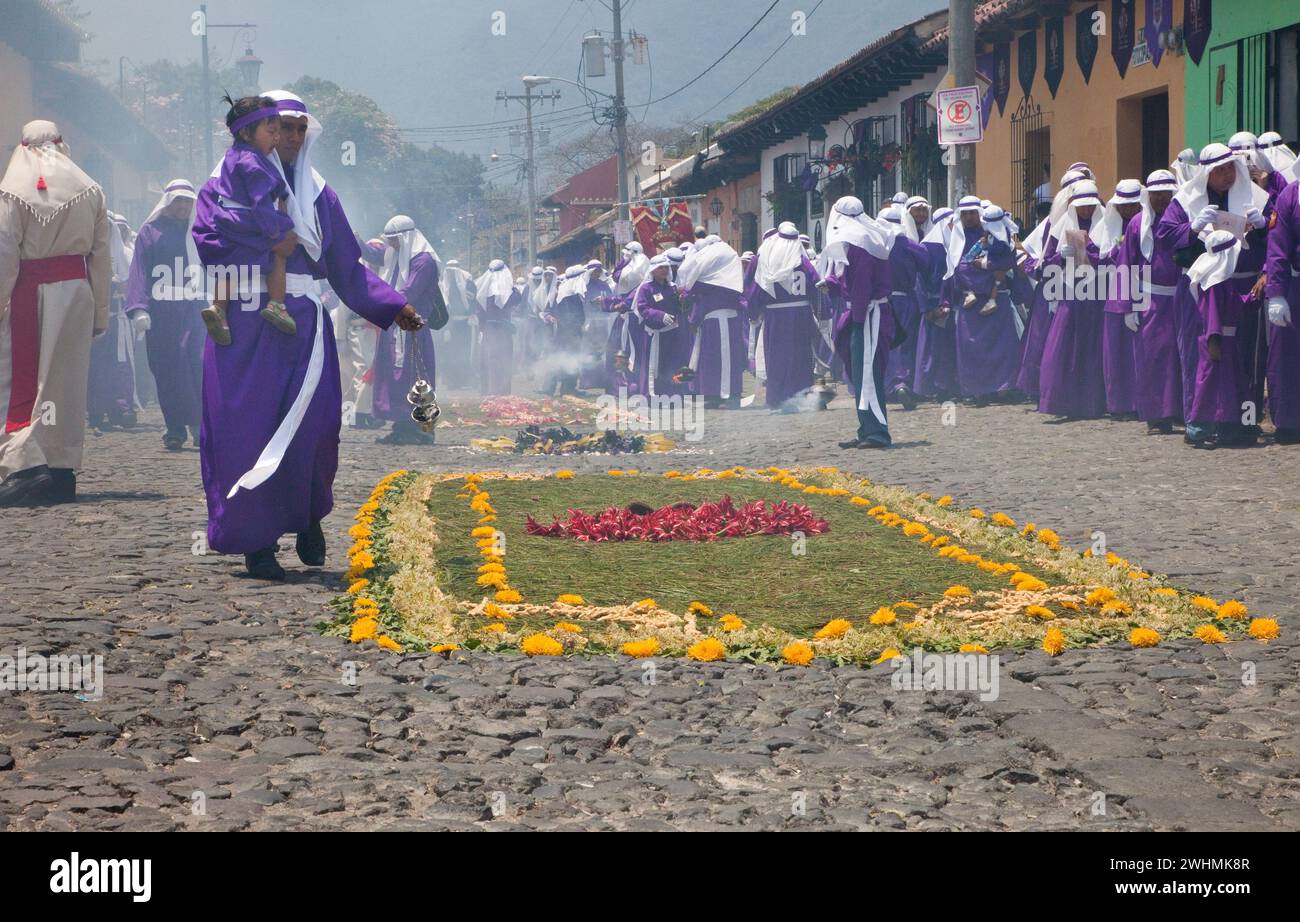 Antigua, Guatemala. Incense fills the air as cucuruchos in purple ...