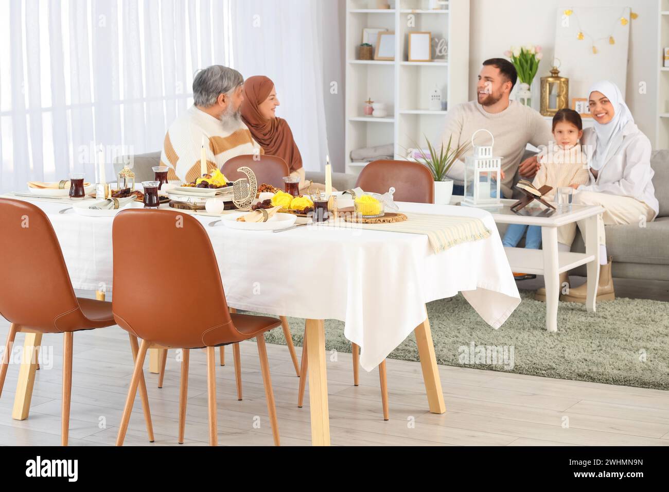 Table with traditional food set for Muslim family at home. Ramadan ...