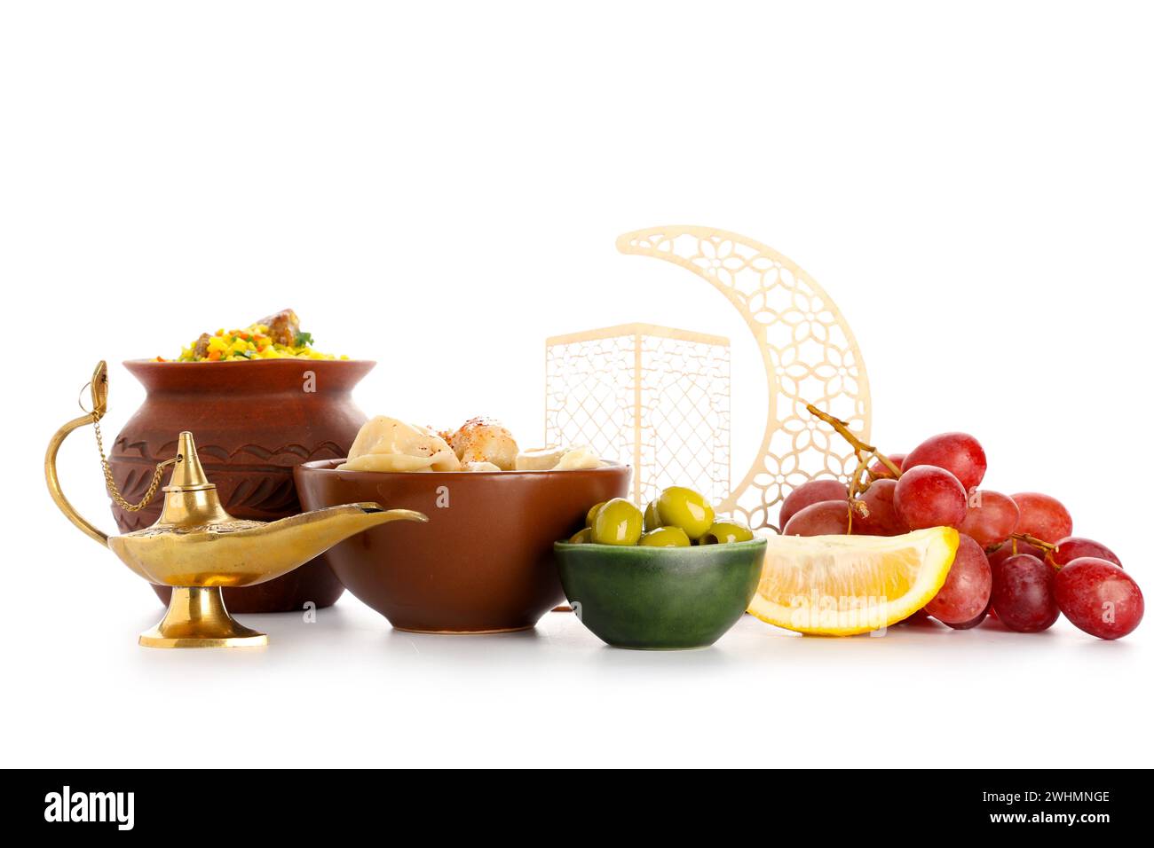 Traditional Eastern dishes, decorative crescent and Aladdin lamp on ...